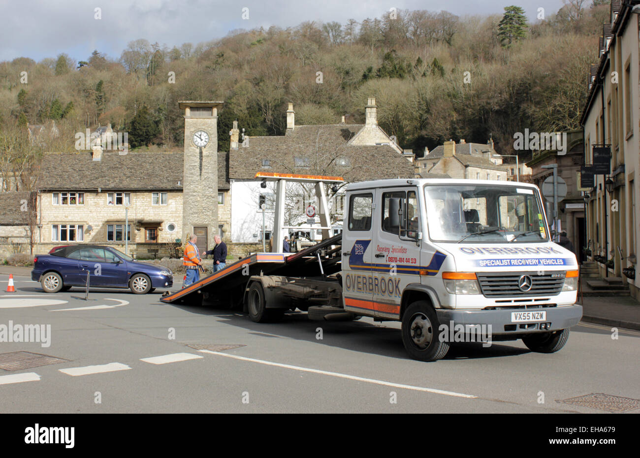 On a bright spring Sunday morning a car's suspension has collapsed and ...