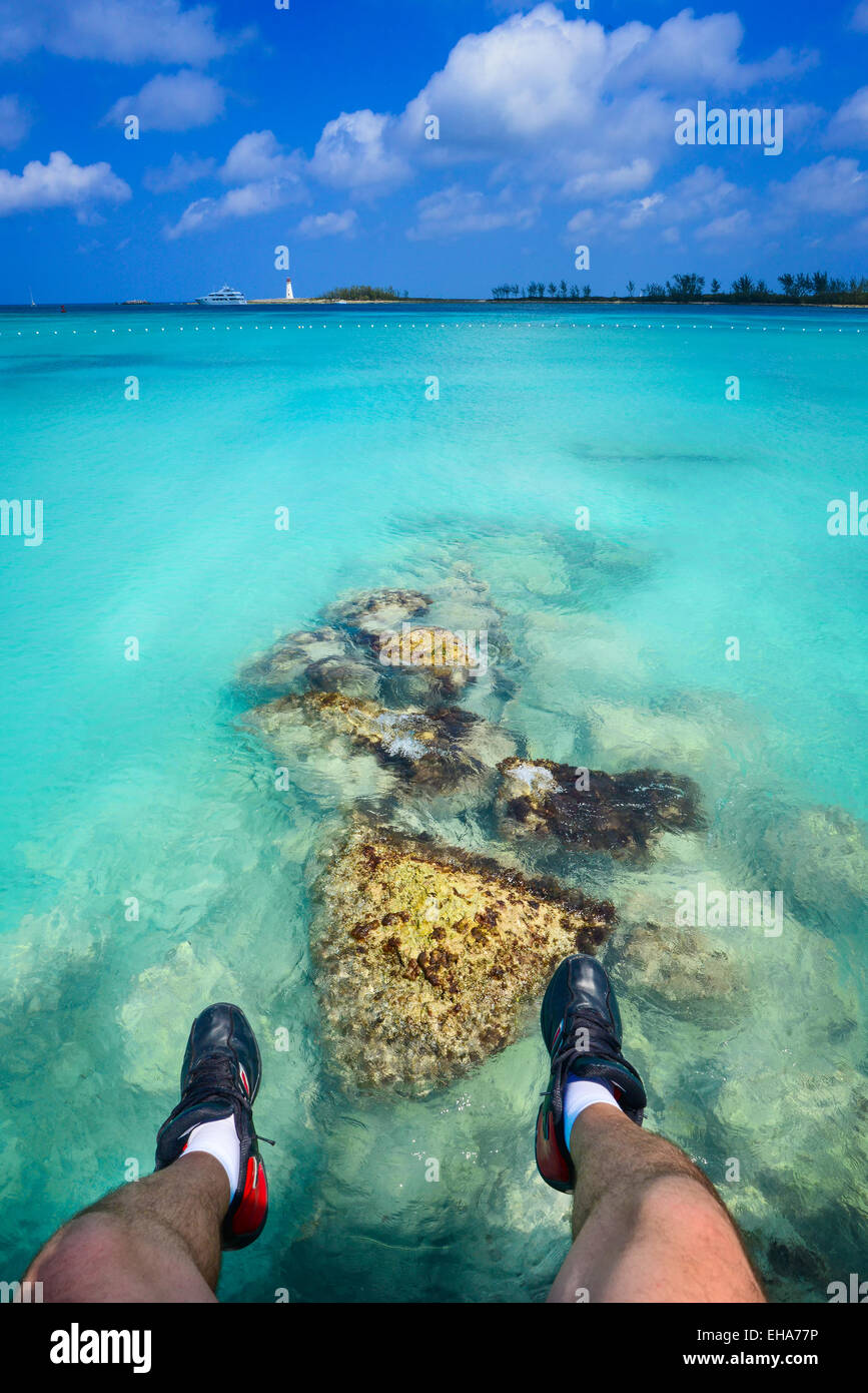 Ocean and legs of man Stock Photo - Alamy