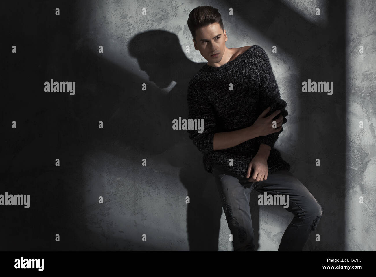 Young slim man wearing trendy woolen sweater Stock Photo - Alamy
