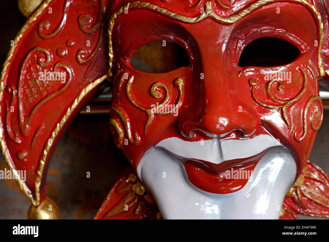 Venetian mask red and white color and side light Stock Photo - Alamy