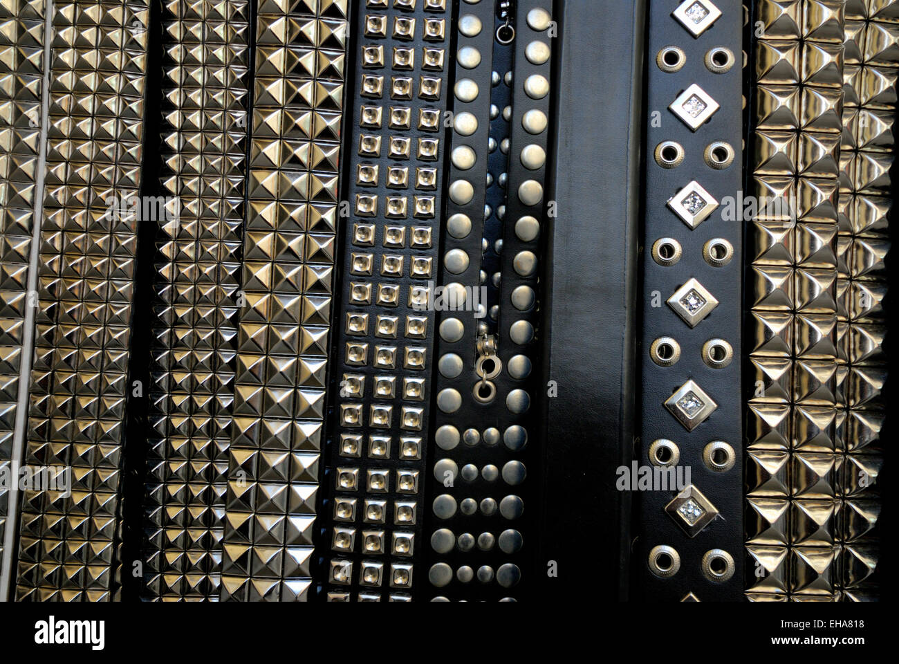 Belts for sale on a leather stall in a city centre market, Florence ...