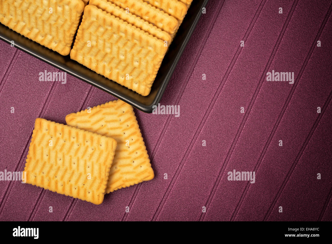 Cookies arranged in a black ceramic vase with purple background Stock ...