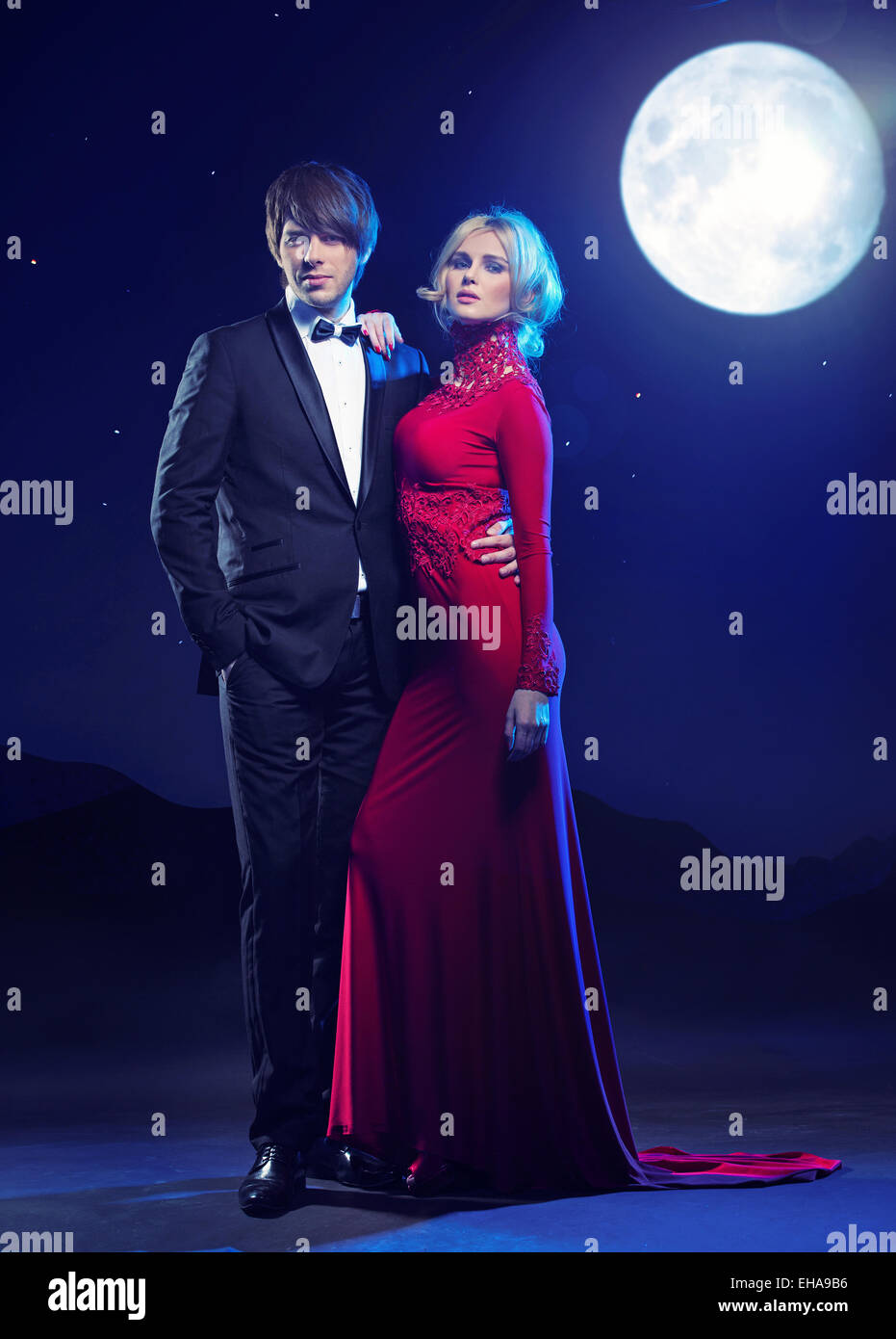 Beautiful young couple on the evening party Stock Photo - Alamy