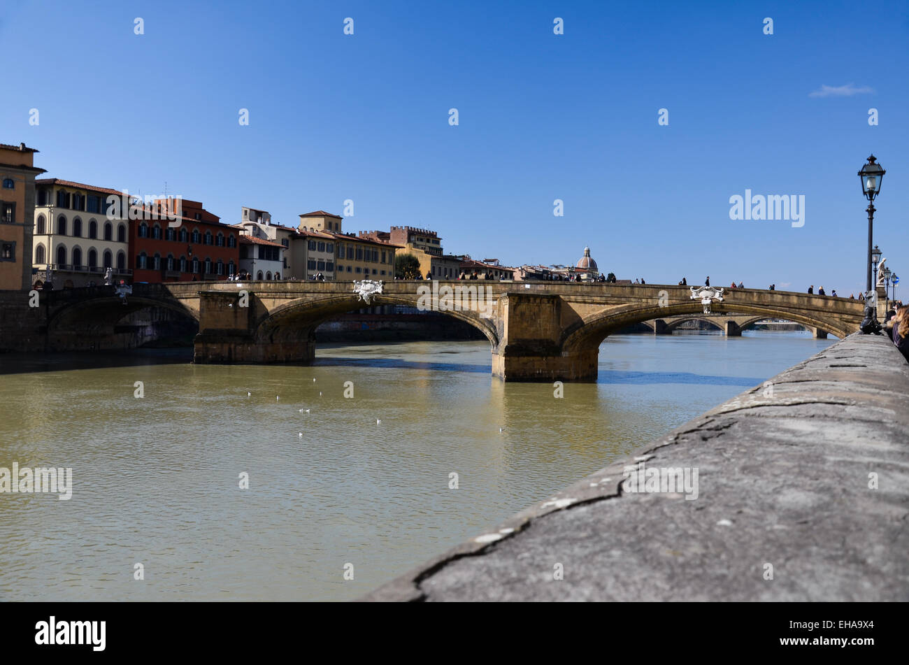 view of the Arno river and the magnificent bridge of the Holy Trinity ...
