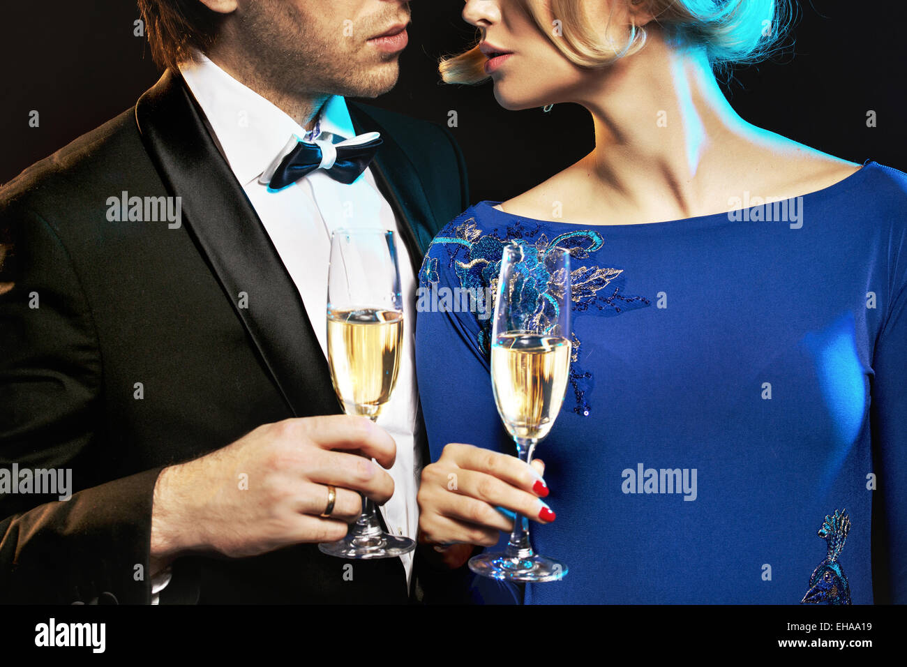 Elegant young couple drinking a champagne Stock Photo - Alamy