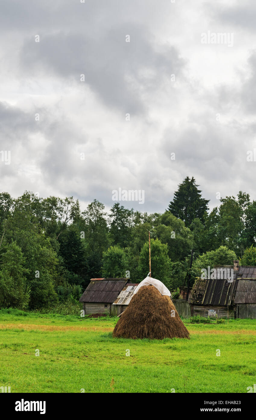 Haystack in village Stock Photo - Alamy
