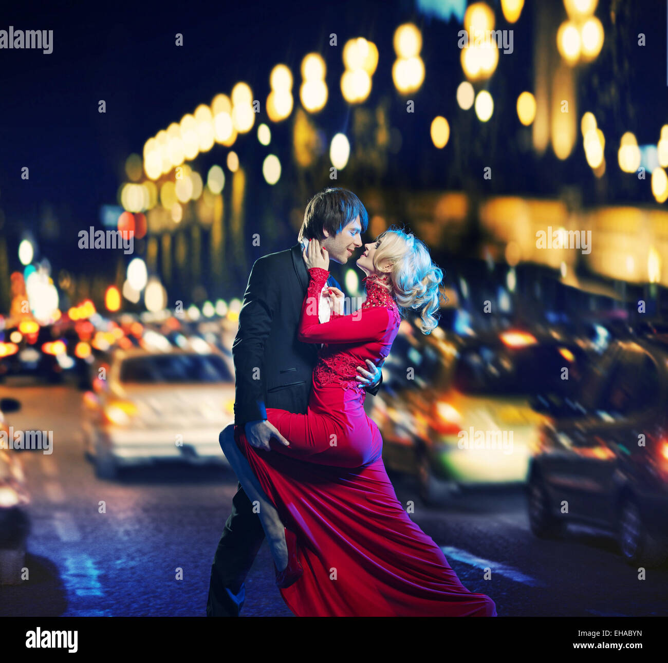Romantic young couple dancing in downtown Stock Photo - Alamy