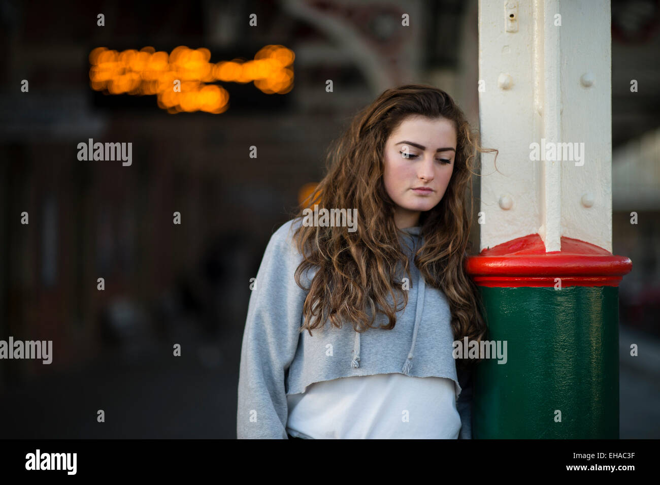 Leaving home: A sad looking lonely young 13 14 15 year old teenage girl ...