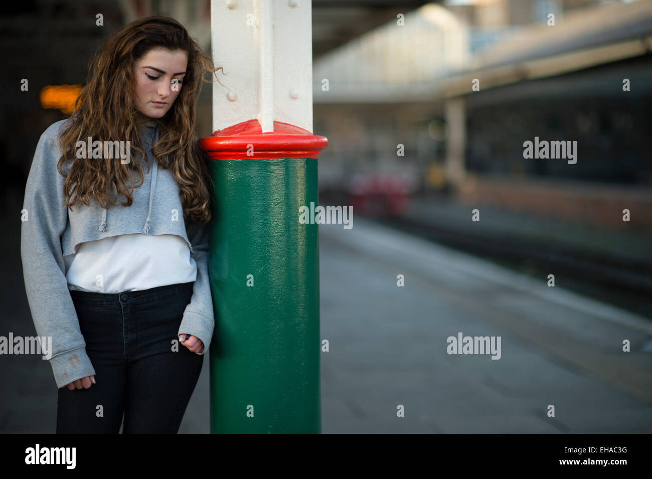 Leaving home: A sad looking lonely young 13 14 15 year old teenage girl ...