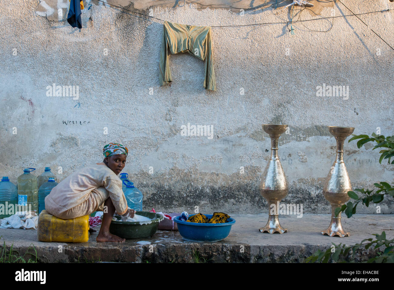 Zanzibar, Woman Washing Clothes, Communist Housing Blocks Along Karume ...
