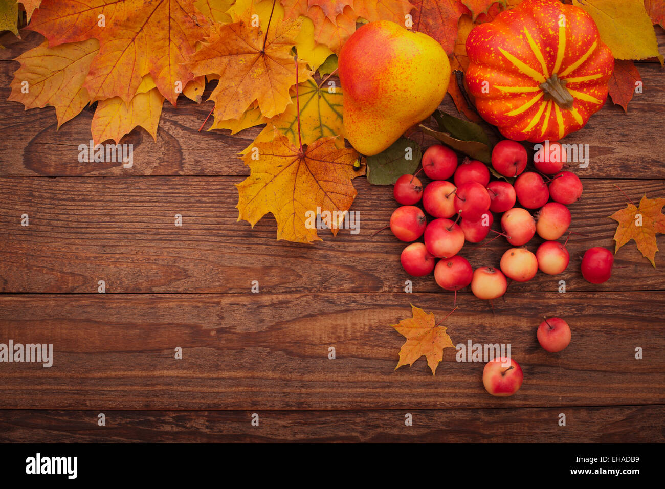 Autumn leaves on wooden table. Fruits and vegetables Stock Photo - Alamy