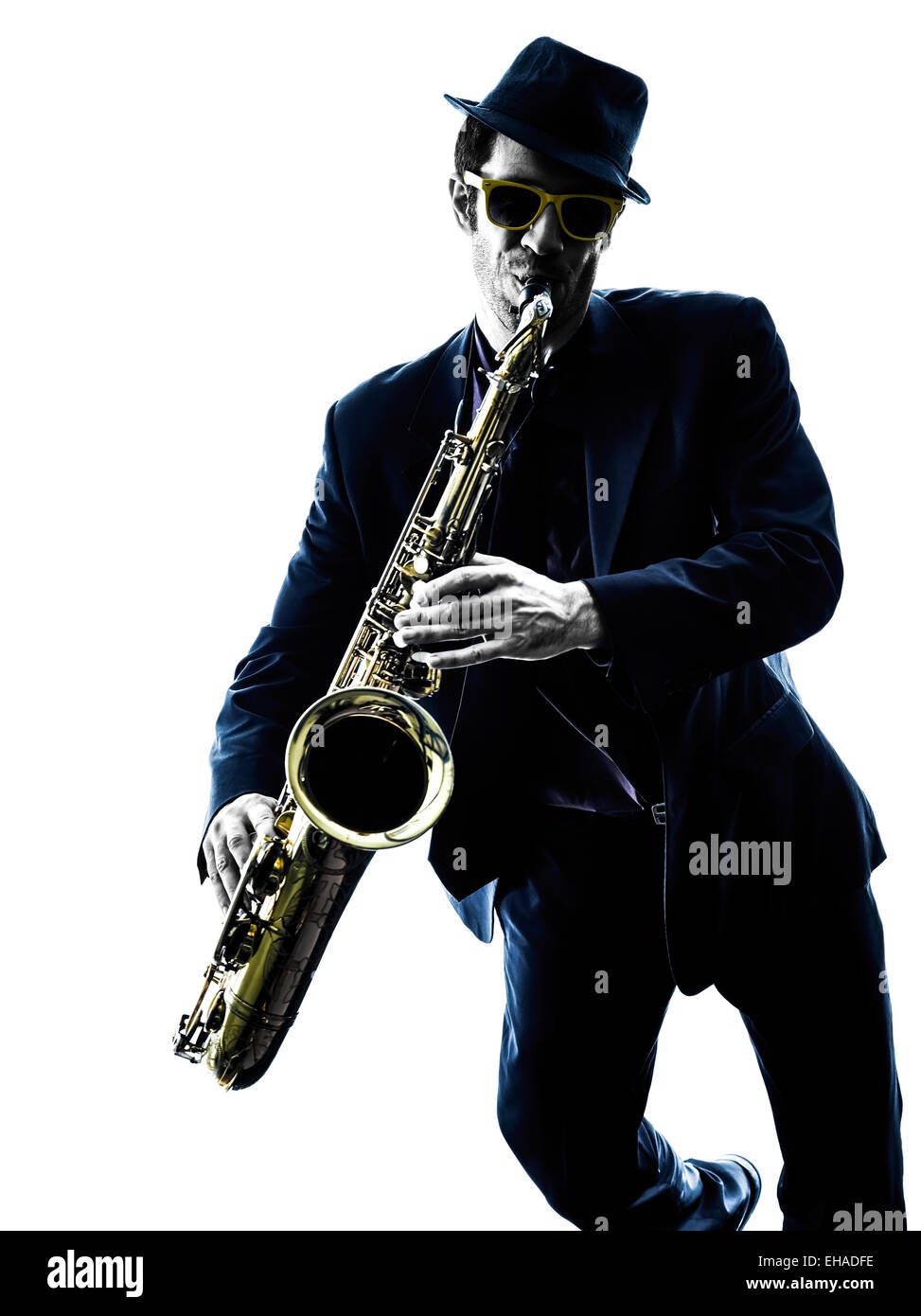 one caucasian man saxophonist playing saxophone player in studio ...