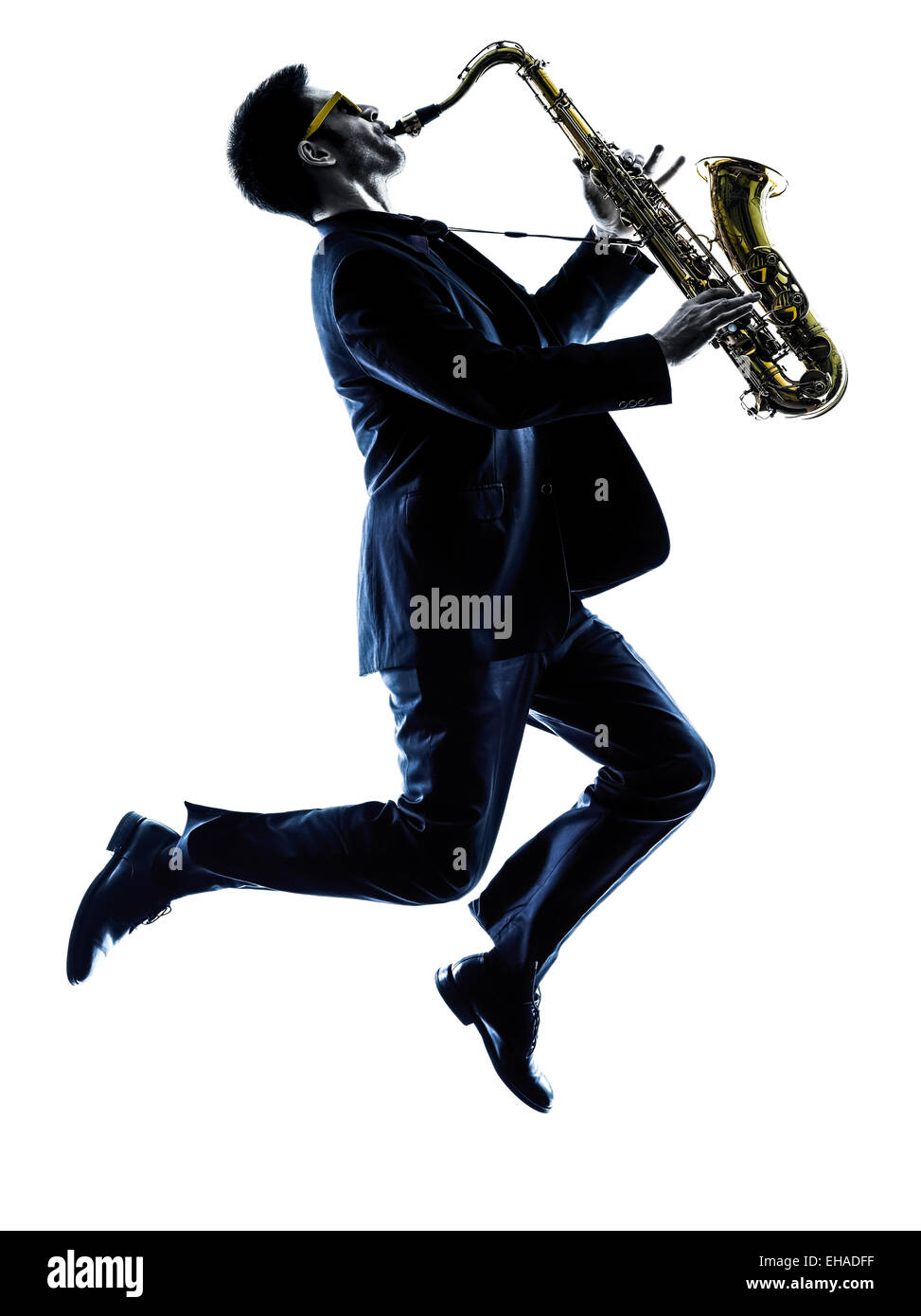 one caucasian man saxophonist playing saxophone player in studio ...