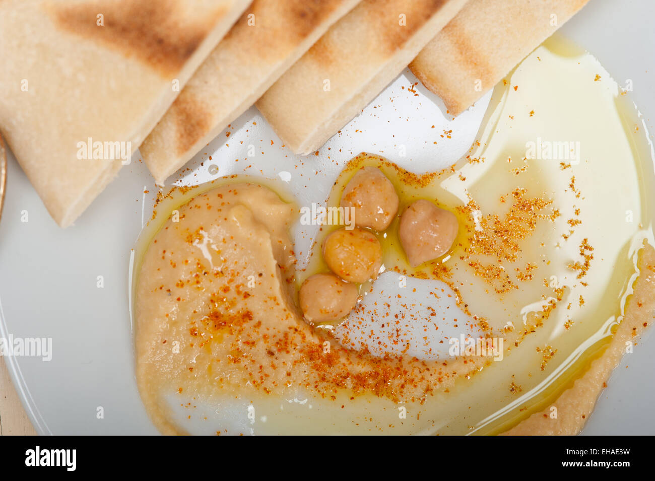 traditional chickpeas Hummus with pita bread and paprika on top Stock ...