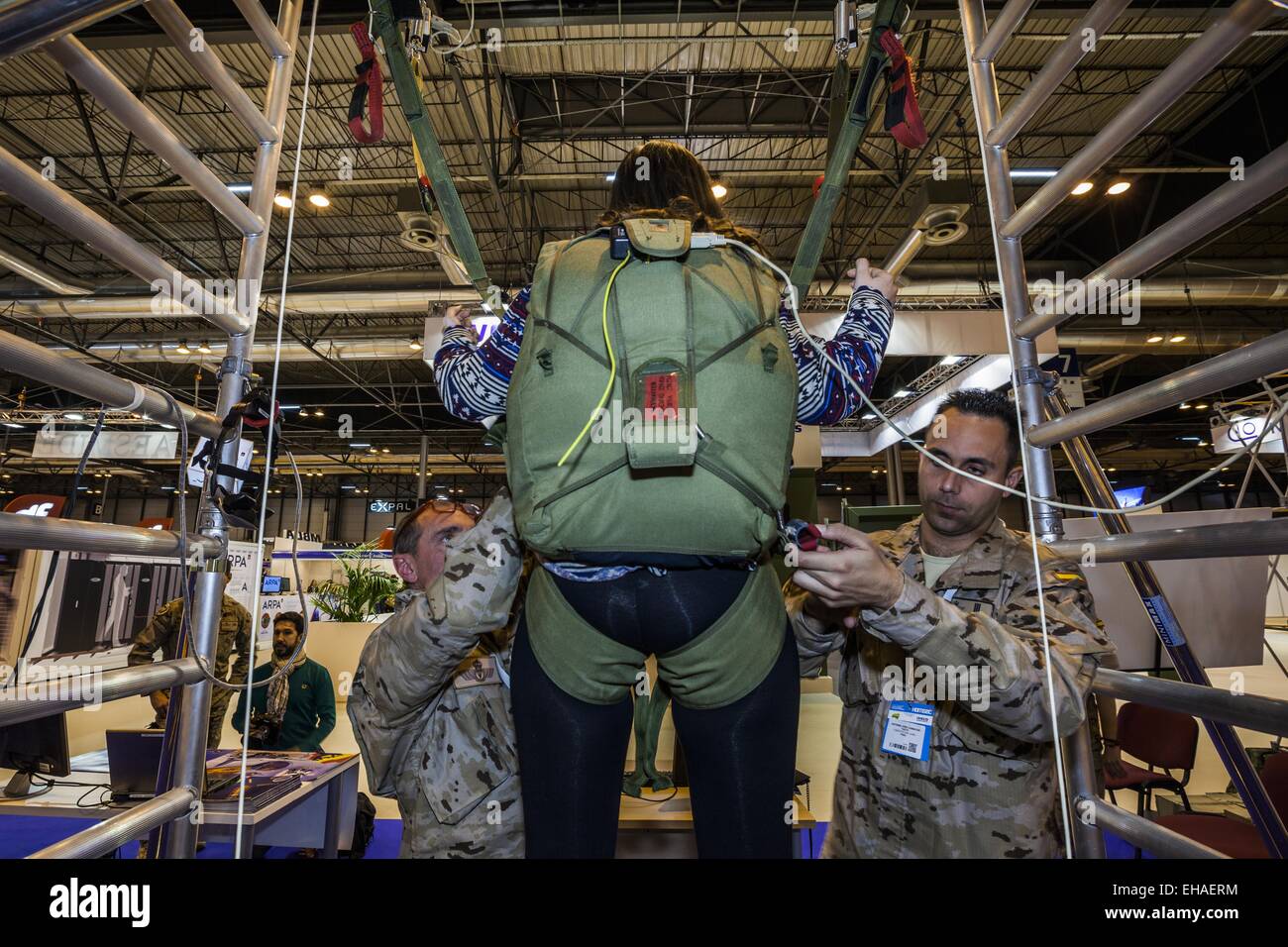 Madrid, , Spain. 10th Mar, 2015. Soldiers adapt straps for a visitor in ...