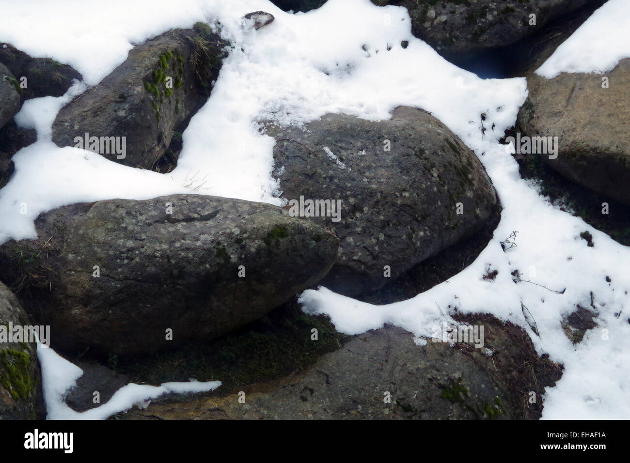 Rocks and snow Stock Photo - Alamy
