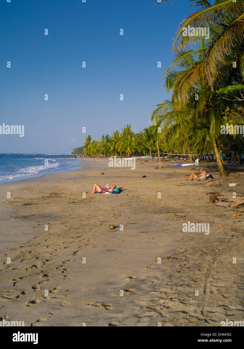 The sun sets at the beach at Manzanillo, Limon, Costa Rica Stock Photo ...