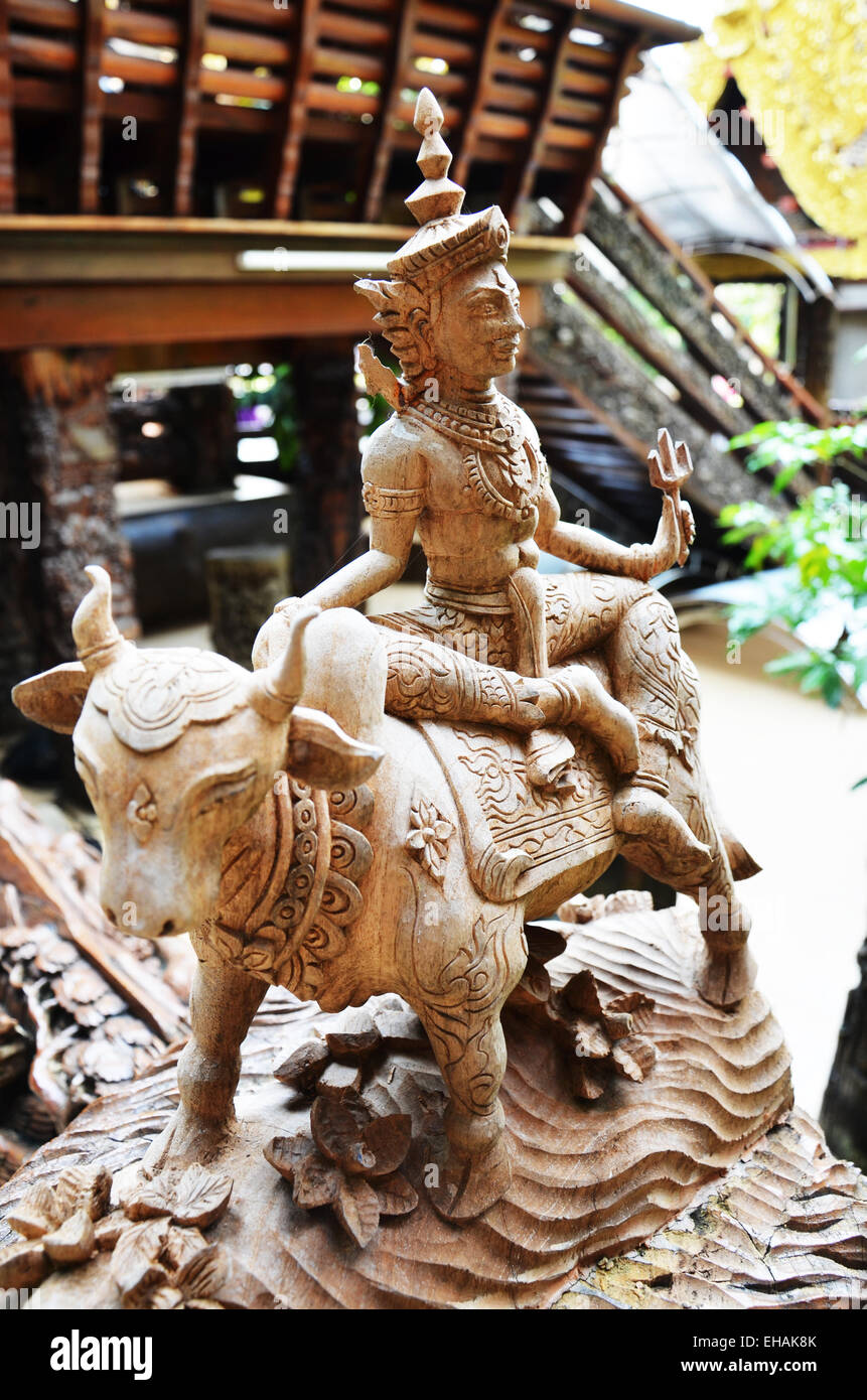 Traditional Thai style wood carving as angel riding ox one of 12 Zodiac ...