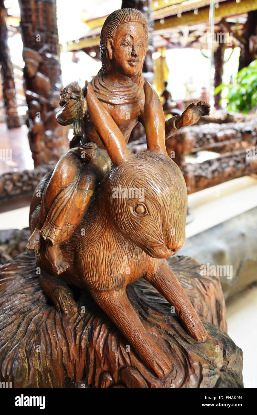 Traditional Thai style wood carving as woman riding rabbit one of 12 ...