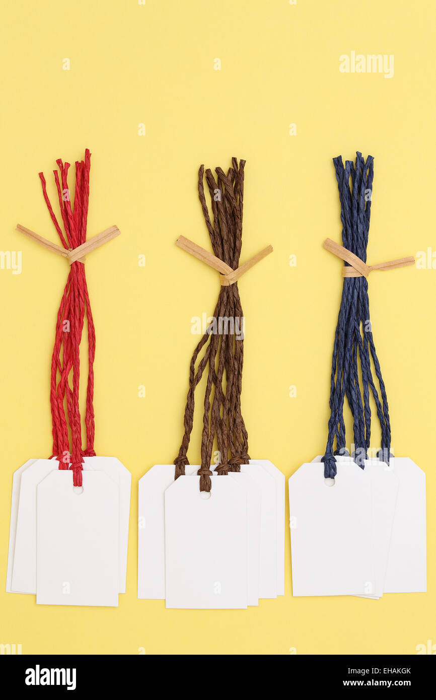 Tag or label on yellow paper background Stock Photo - Alamy