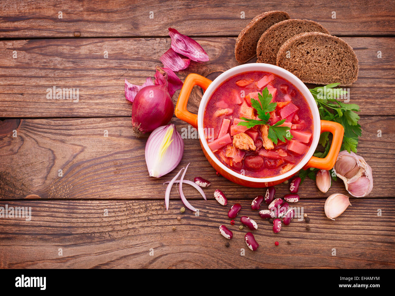 Ukrainian and Russian national Red Borscht on wooden surface, menu ...