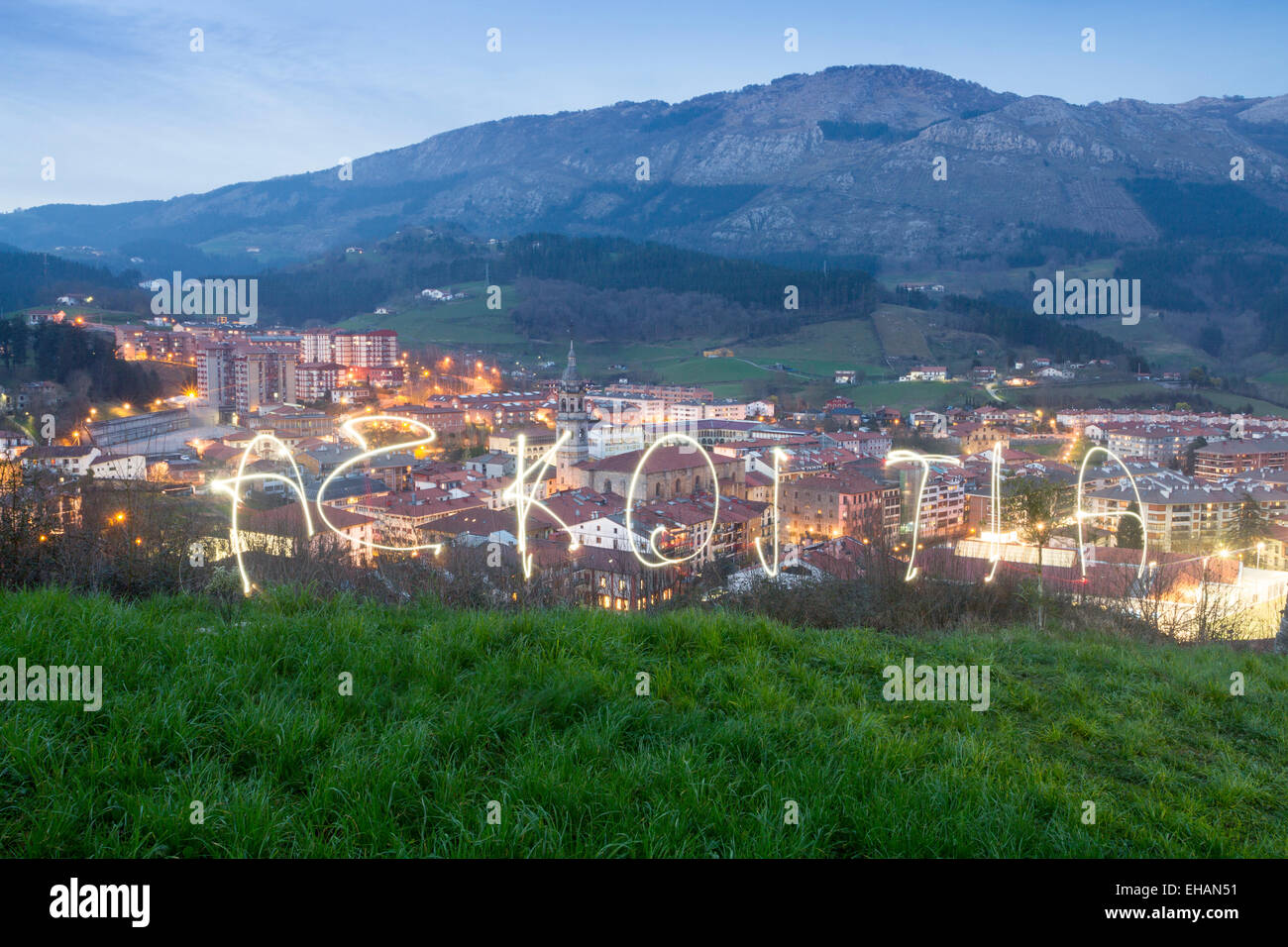 Light painting at night in Azkoitia village, viewed from San Martin ...