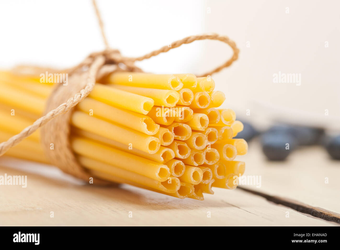 bunch of Italian pasta type on a white rustic table Stock Photo - Alamy