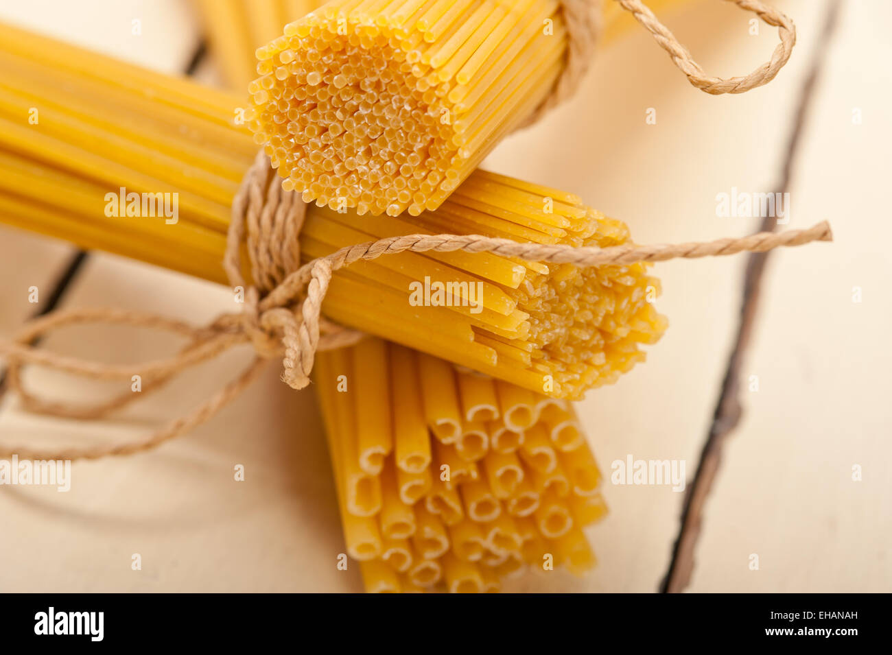 bunch of Italian pasta type on a white rustic table Stock Photo - Alamy
