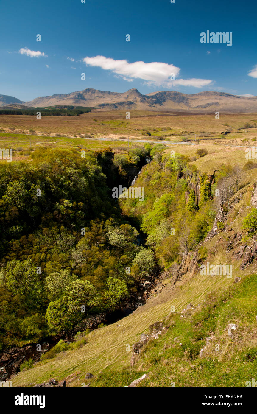 The Lealt River tumbling through a ravine at An Lethallt with the hills ...