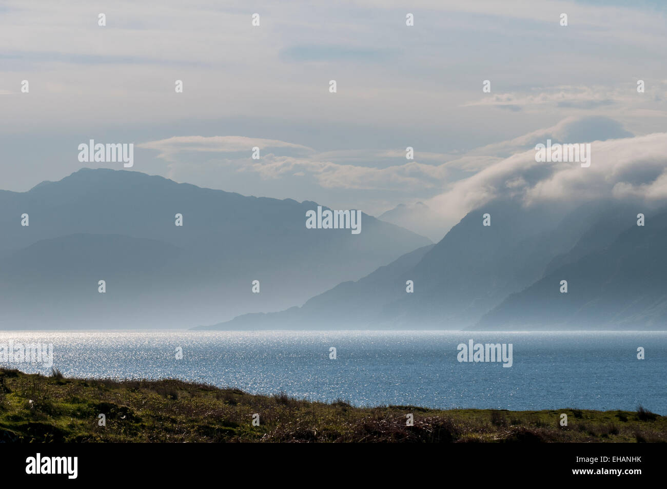 The hills of the western highlands, shrouded in mist seen across the ...