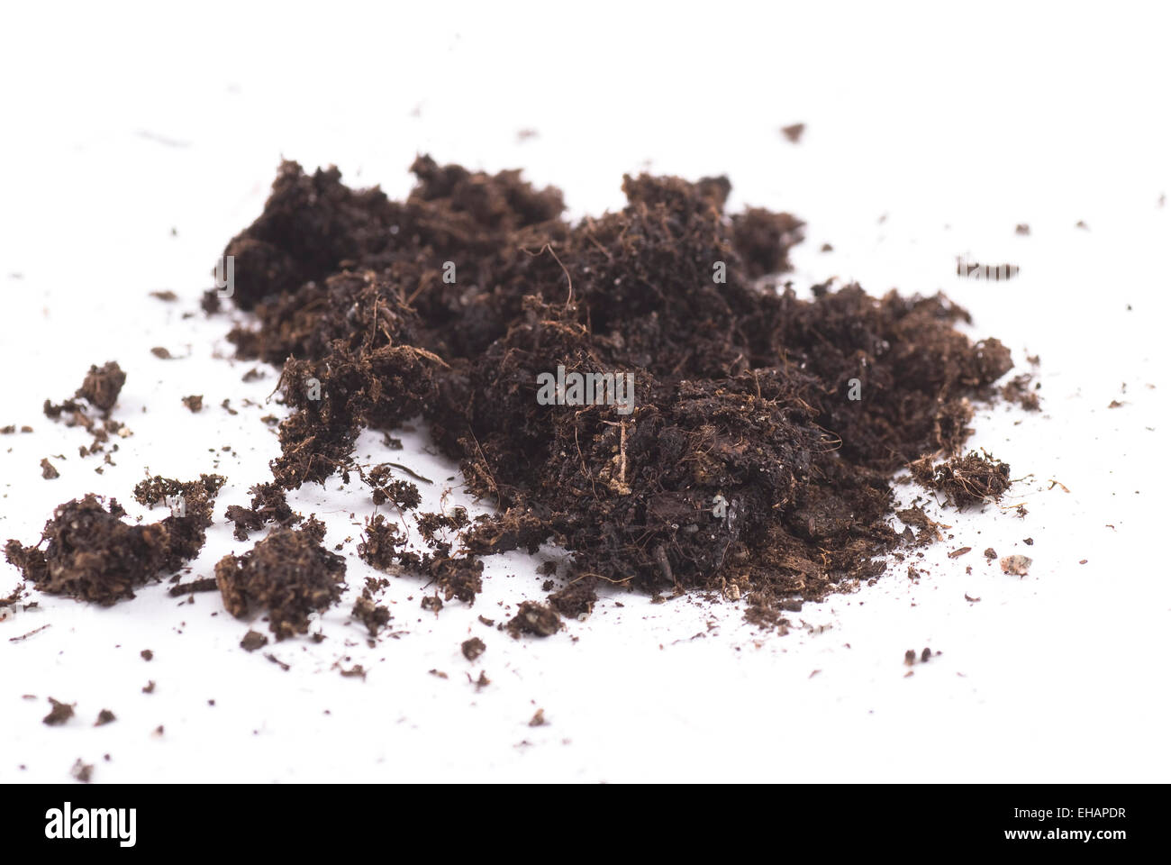 Organic compost soil on white background Stock Photo - Alamy
