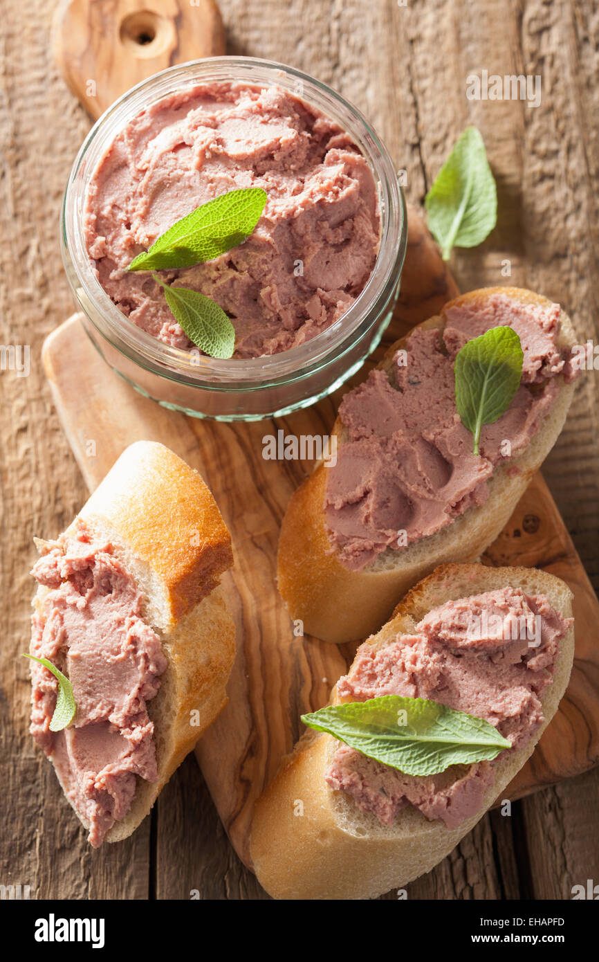 healthy chicken liver pate with sage in jar and on bread Stock Photo ...