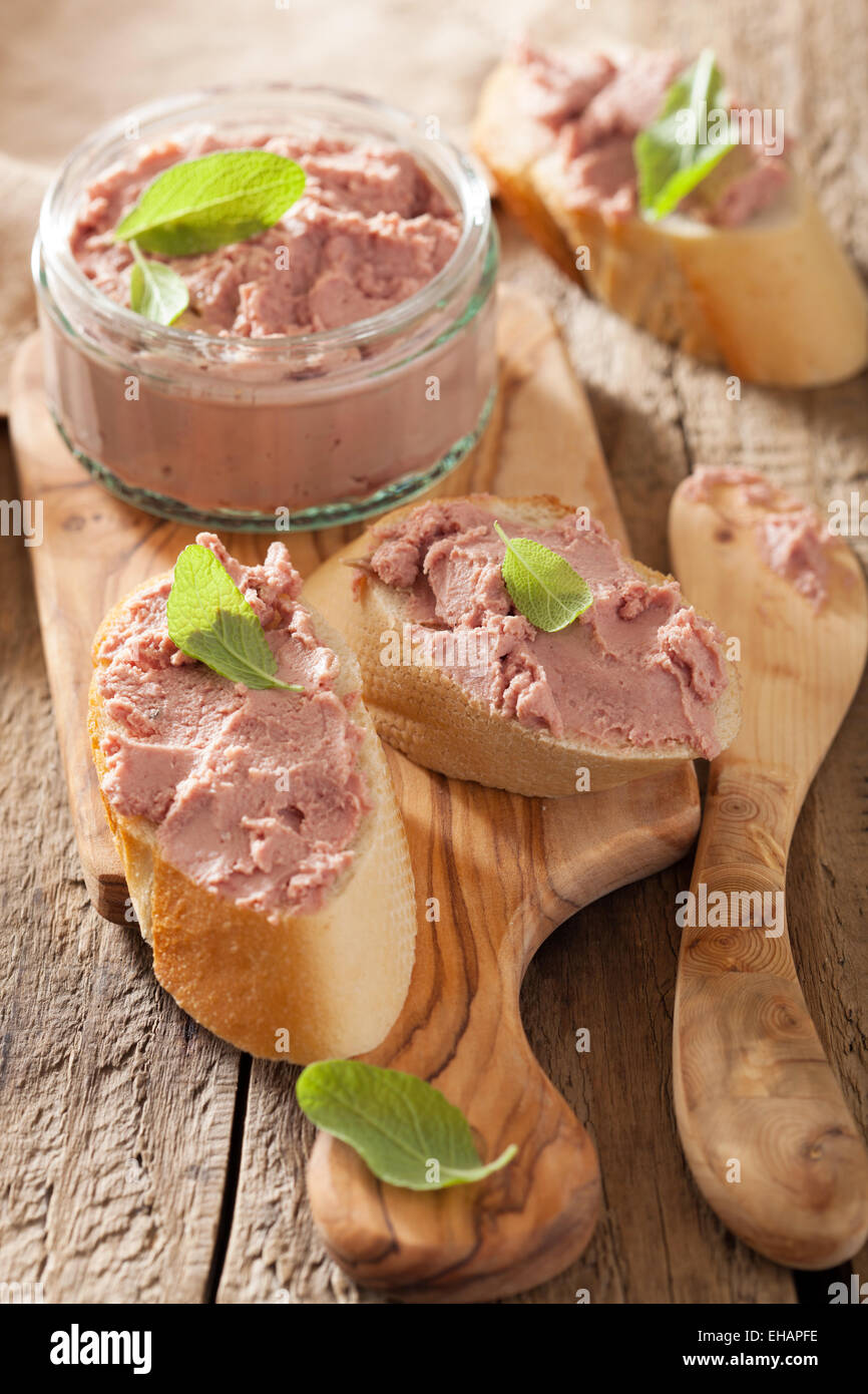 healthy chicken liver pate with sage in jar and on bread Stock Photo ...