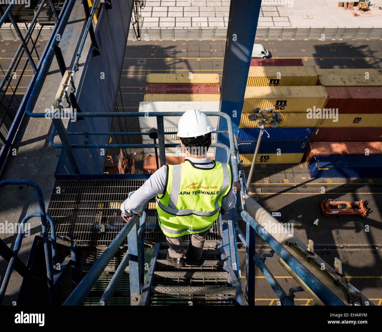 Worker descending a crane. Port of Callao, Callao, Peru. Architect ...