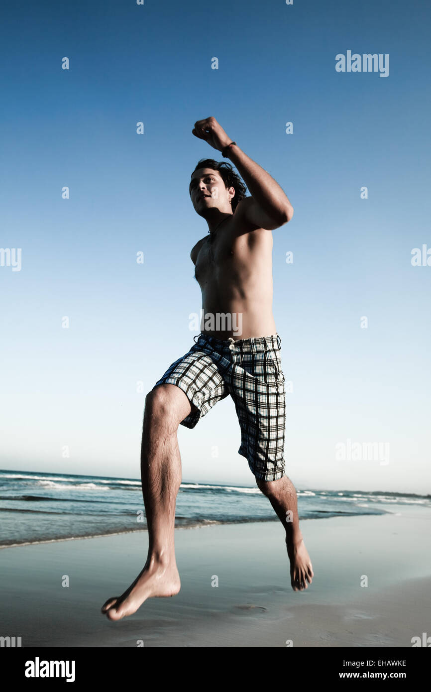 Man running into waves hi-res stock photography and images - Alamy
