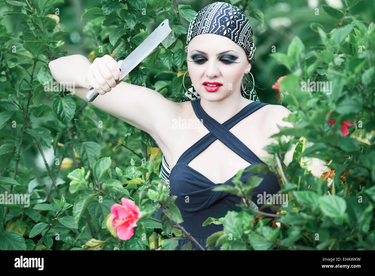 Woman with a knife Stock Photo - Alamy