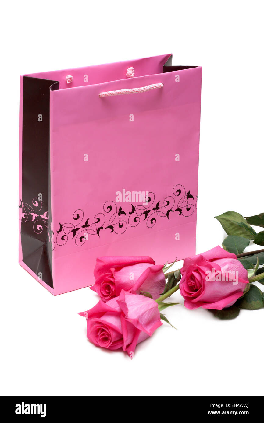 Rose gift package and three roses Stock Photo - Alamy