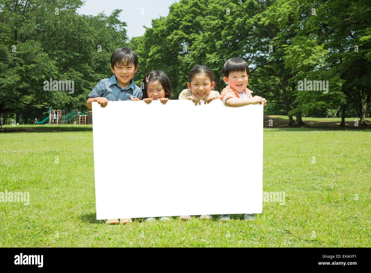 Japanese kids with whiteboard in a park Stock Photo - Alamy