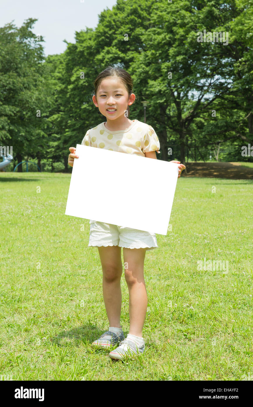 Japanese kid with whiteboard in a park Stock Photo - Alamy