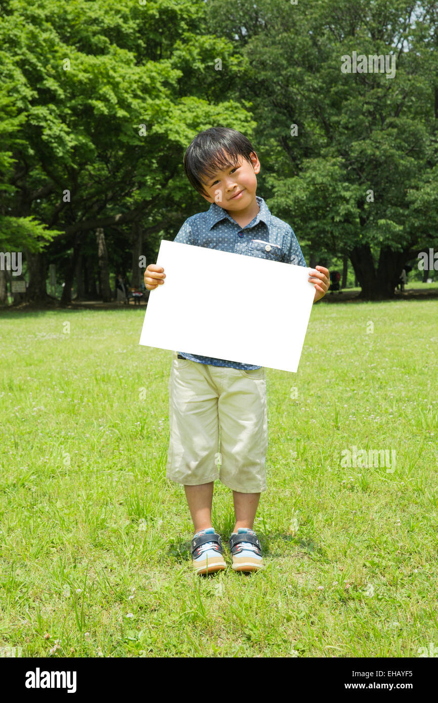 Japanese kid with whiteboard in a park Stock Photo - Alamy