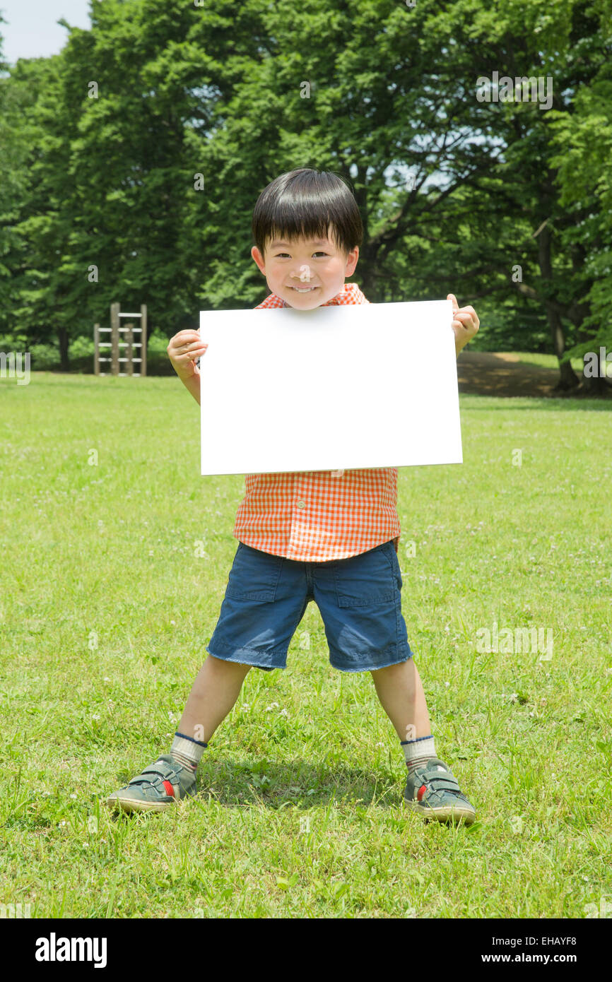 Japanese kid with whiteboard in a park Stock Photo - Alamy
