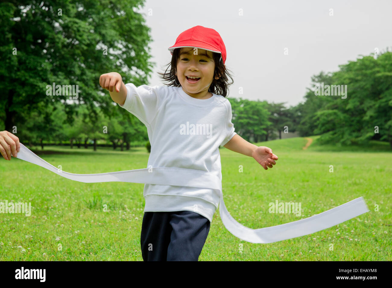Japanese kid running in a park Stock Photo - Alamy