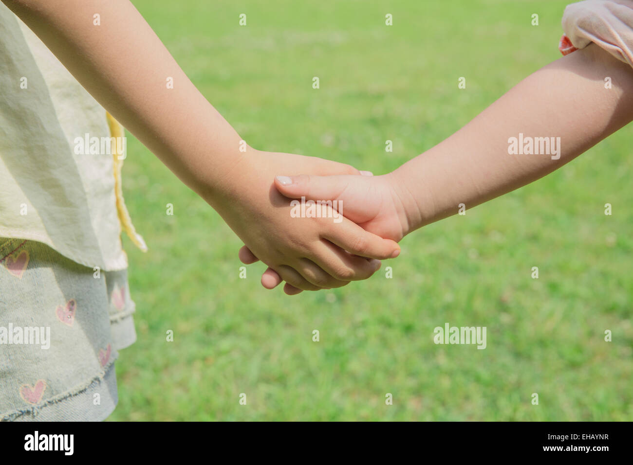 Two boys shaking hands children hi-res stock photography and images - Alamy