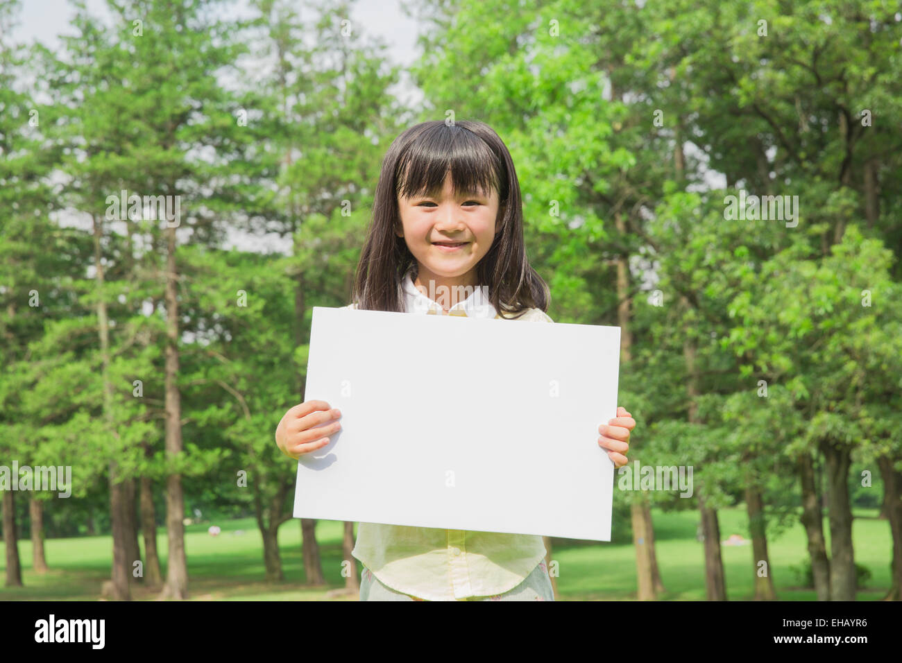 Japanese kid with whiteboard in a park Stock Photo - Alamy