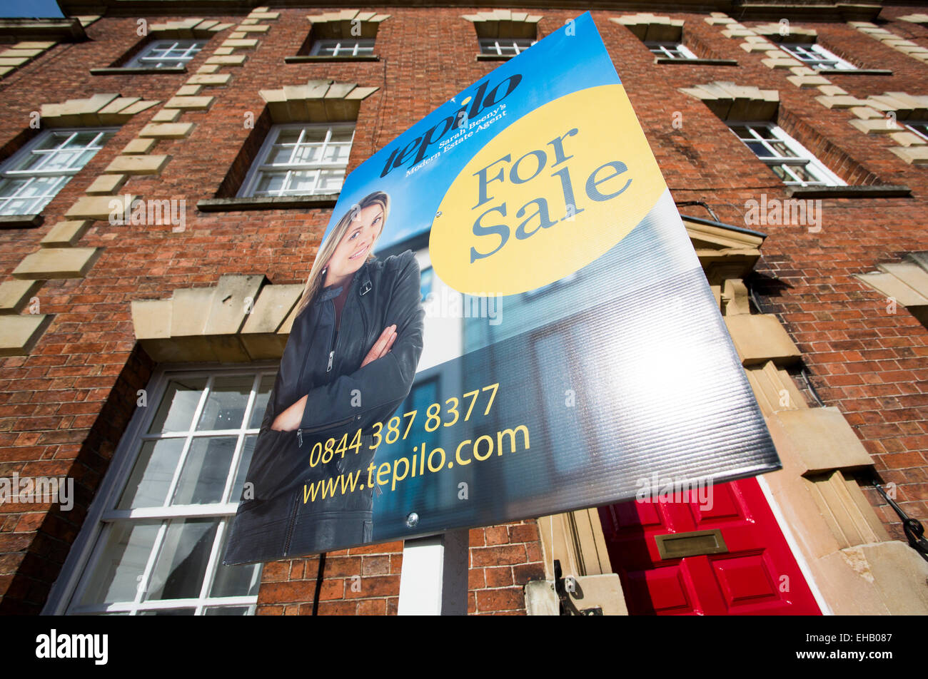 Sign for Tepilo, Sarah Beeny's modern estate agent outside a terraced ...