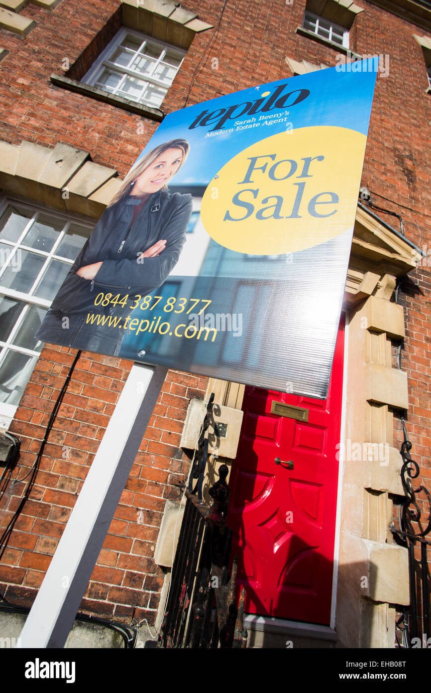 Sign for Tepilo, Sarah Beeny's modern estate agent outside a terraced ...