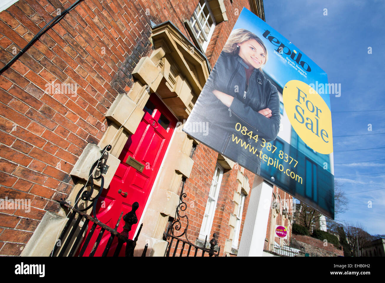 Sign for Tepilo, Sarah Beeny's modern estate agent outside a terraced ...