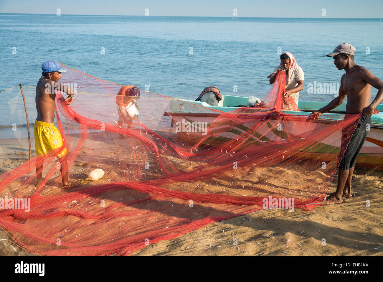 Cleaning nets on beach hi-res stock photography and images - Alamy