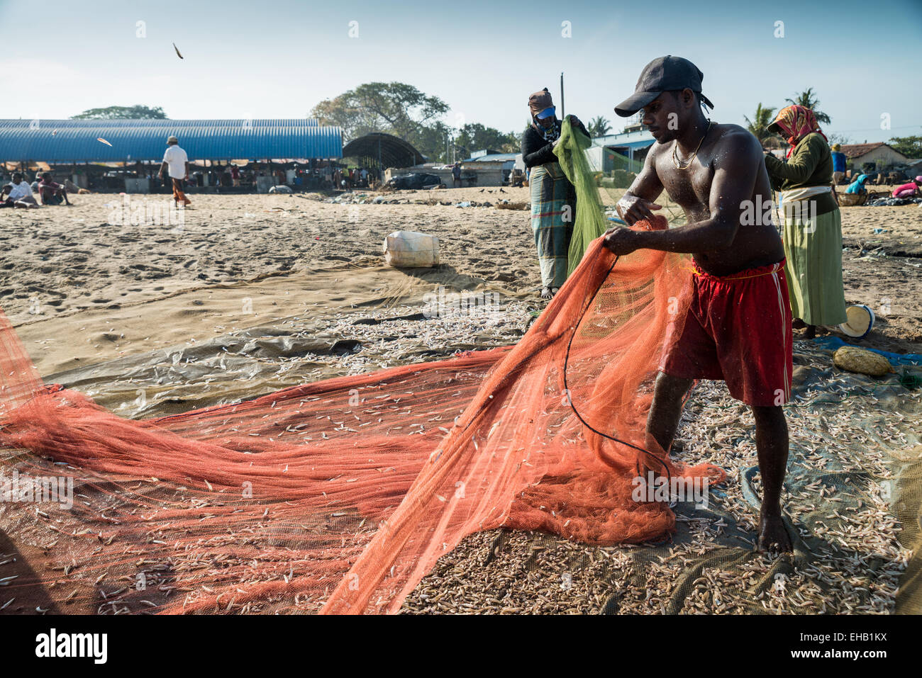 Cleaning nets on beach hi-res stock photography and images - Alamy