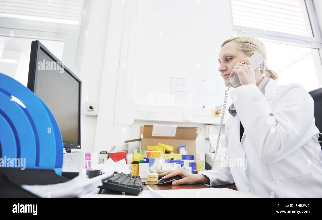 pharmacy worker talking by phone Stock Photo - Alamy